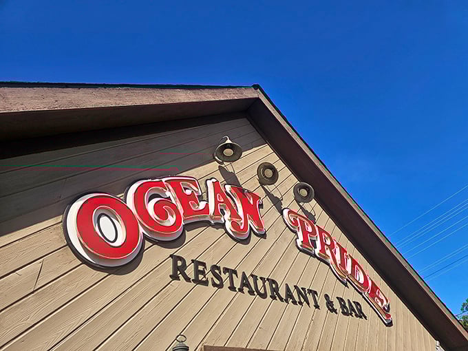 Ocean Pride's sign glows with seafood promise. Like spotting an old friend waving you over for the catch of the day.