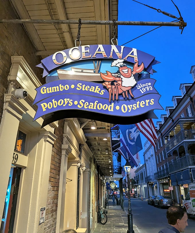 Oceana's cheerful crab sign beckons seafood lovers. Where the French Quarter's magic extends from the streets to your plate.