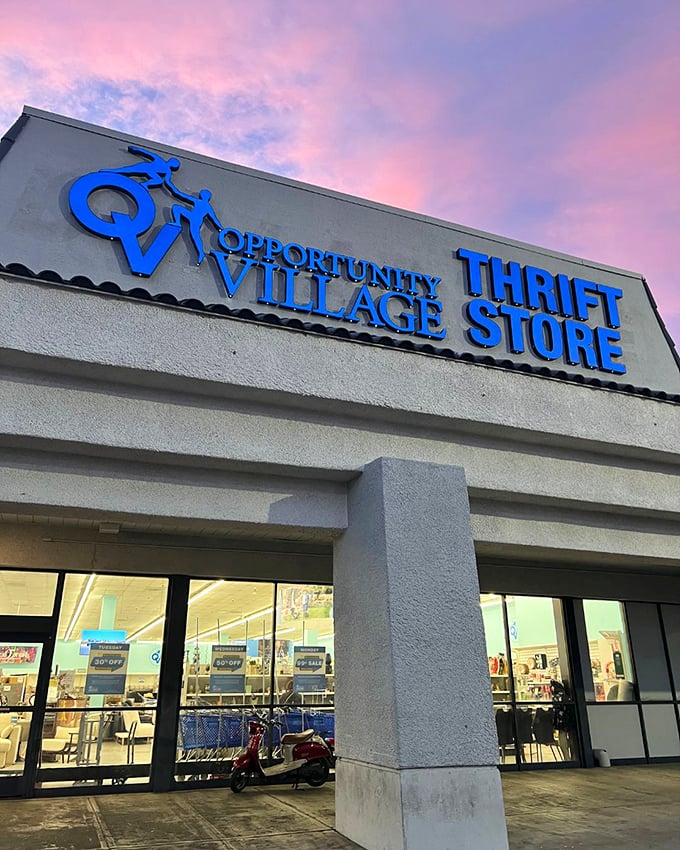 Opportunity Village's sign glows against a sunset sky, like a Vegas marquee promising not jackpots, but something better: guilt-free retail therapy.