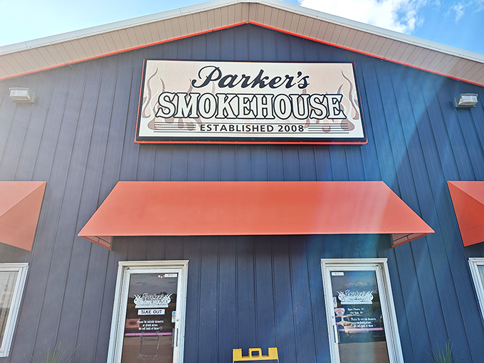 Parker's Smokehouse stands proud in blue and orange, like a beacon calling all barbecue lovers to come on in.