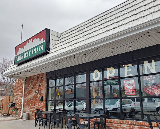 Parkway Pizza's vintage sign against that seafoam building &ndash; like finding a pizza oasis in an urban desert.