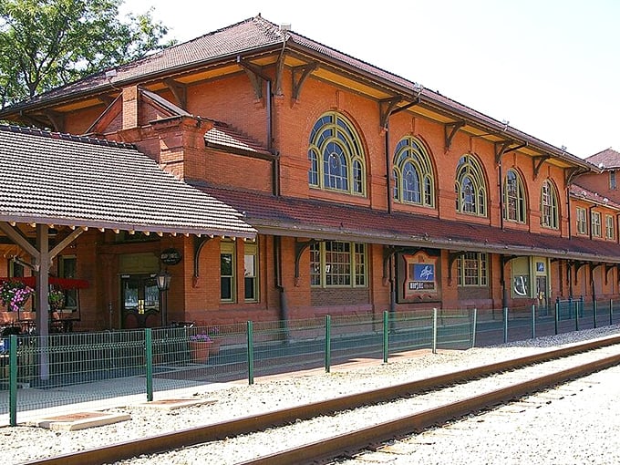 All aboard the savings train! Peoria's brick station stands like a postcard from simpler times, when retirement meant actual relaxation, not budget spreadsheets.