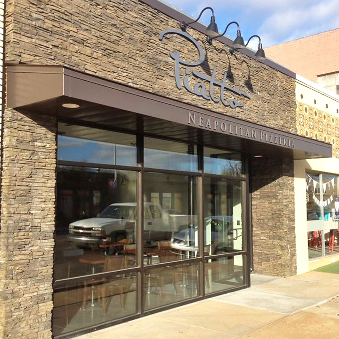 Piatto's stone exterior hints at the rustic Italian experience waiting inside. Pizza architecture at its finest!