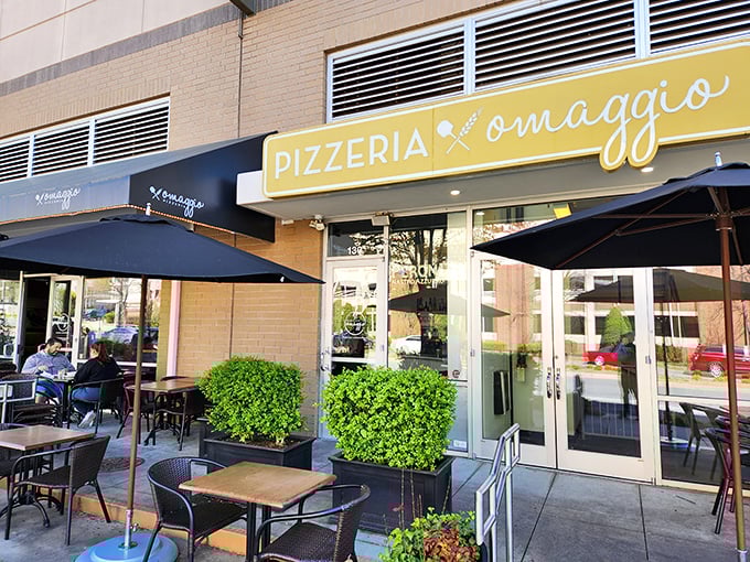 Midday pizza paradise! Omaggio's sunny yellow sign and inviting patio create the perfect setting for playing hooky from that afternoon meeting.