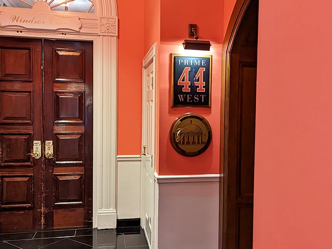 Prime 44 West's dining room feels like stepping into a Scottish manor where plaid carpets and white tablecloths set the stage for culinary magic.