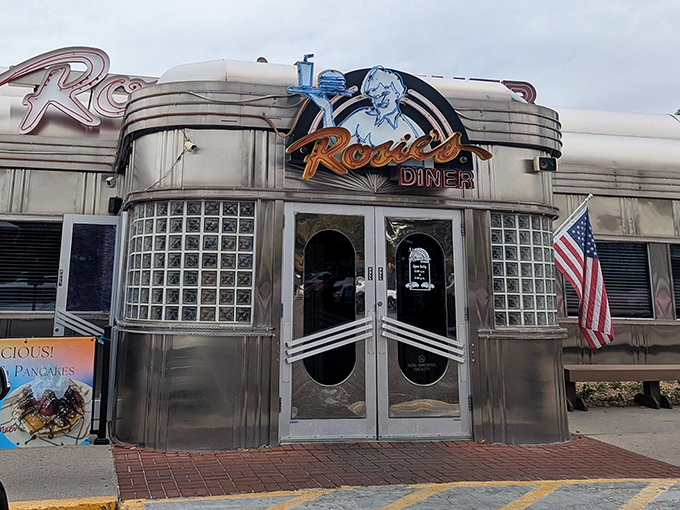 Rosie's Diner: Chrome, neon, and nostalgia! This gleaming silver time machine serves up breakfast with a side of 1950s Americana.
