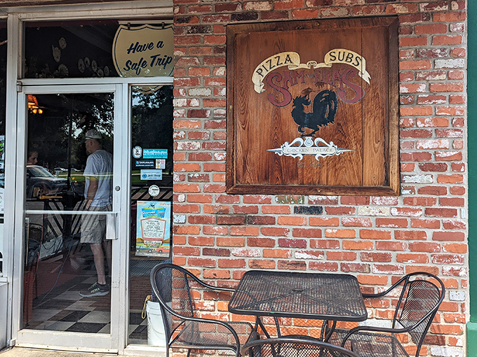 Sam & Ella's charming brick facade and wooden sign offer a delightful wordplay and even better pizza. Sometimes the best treasures hide in plain sight.
