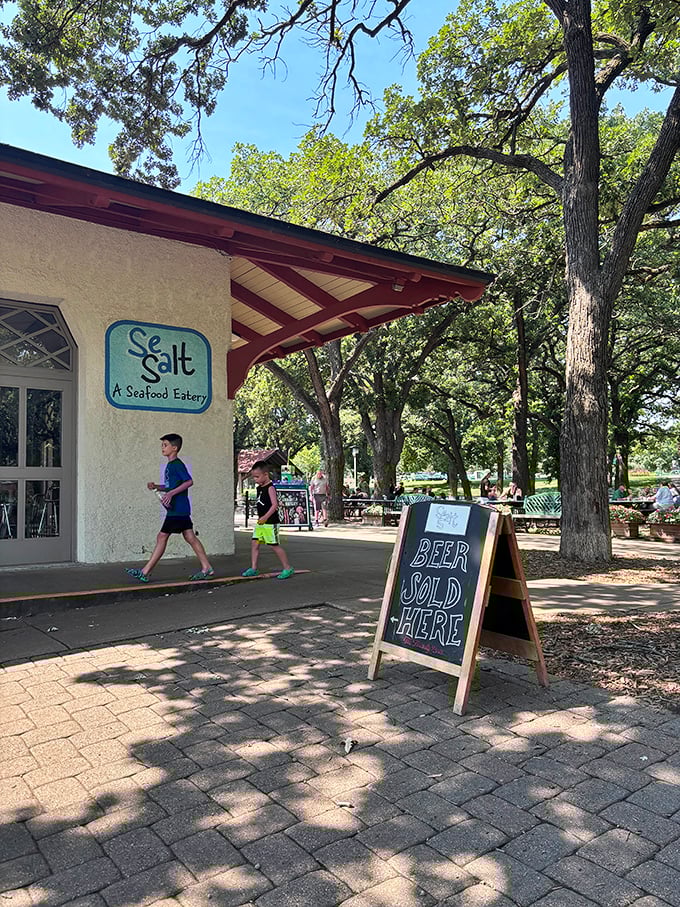 Sea Salt's outdoor setting under leafy trees makes every meal feel like a perfect summer picnic with ocean flavors.