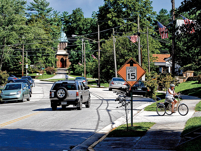 Sewanee's tree-lined streets create nature's own cathedral ceiling above your head.