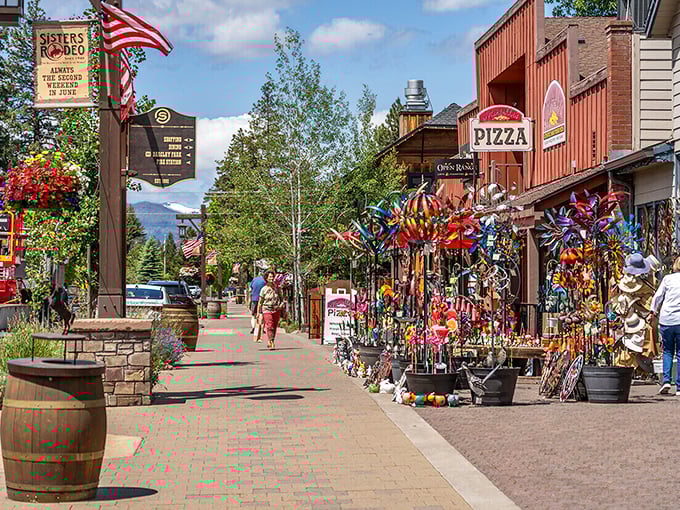 The colorful whirligigs and pinwheels of Sisters' main street shops create a playful contrast against the serious mountain backdrop.