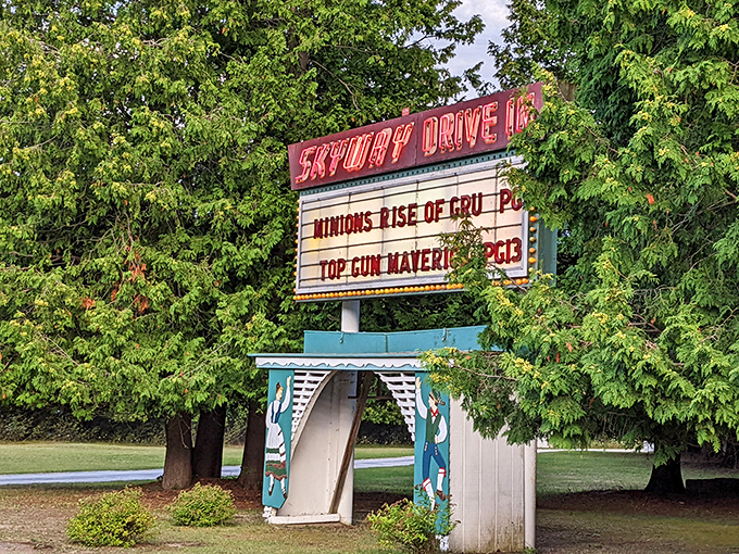 Neon nostalgia alert! Skyway's charming marquee promises Minions mischief and Maverick thrills, framed by Door County's lush summer greenery.