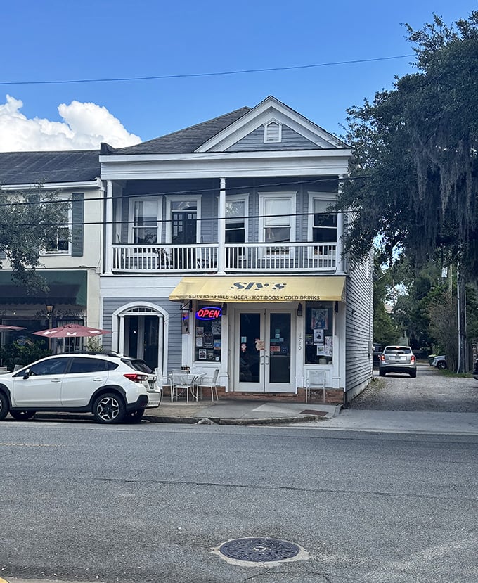 Sly's historic white building whispers tales of Southern hospitality from its wraparound porch perch.