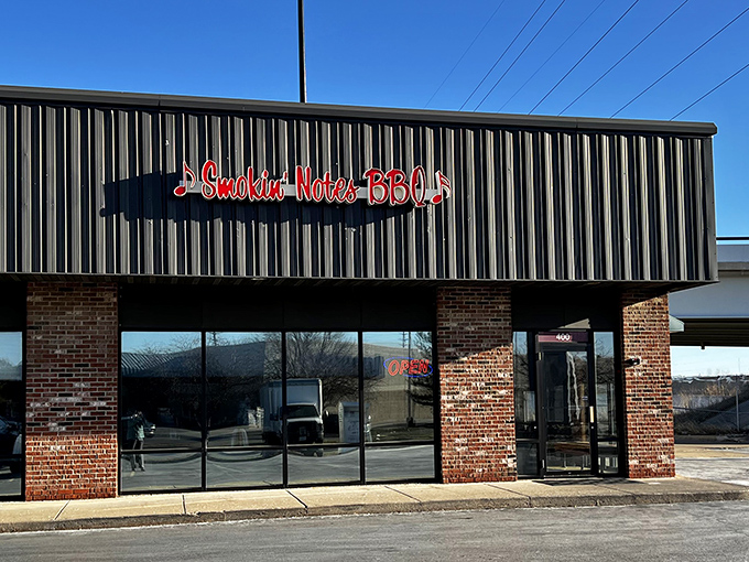 Smokin' Notes BBQ's red musical sign hints at the symphony of flavors waiting inside this unassuming East Peoria meat paradise.