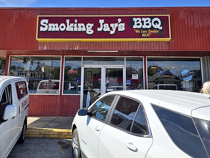 That red storefront with "We Love Smokin' Meat" says everything you need to know about passion.