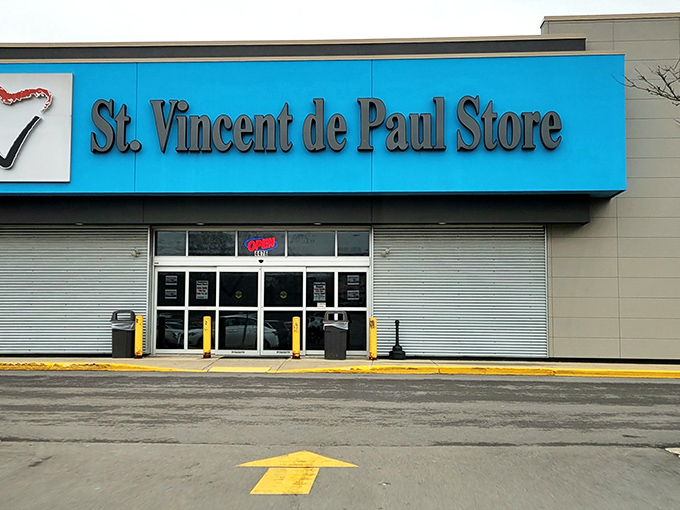 St. Vincent de Paul's bright blue storefront stands out like a sapphire in a shopping center, promising treasures within.
