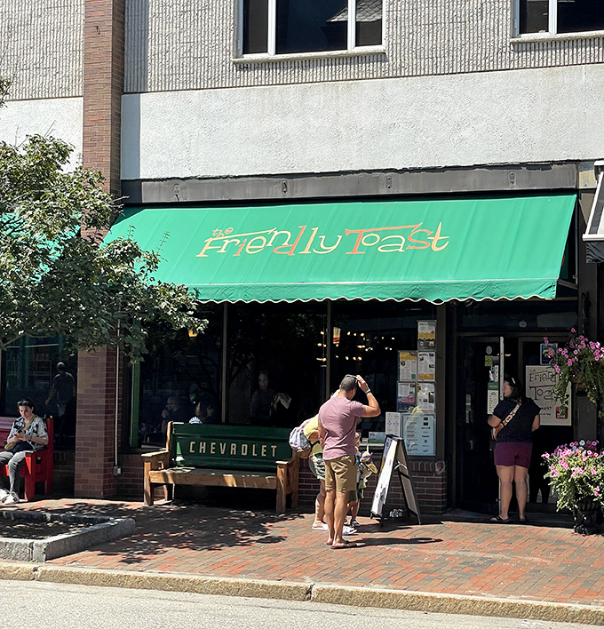 That vibrant green awning beckons like a breakfast oasis - where creative morning meals meet downtown Portsmouth's historic charm.