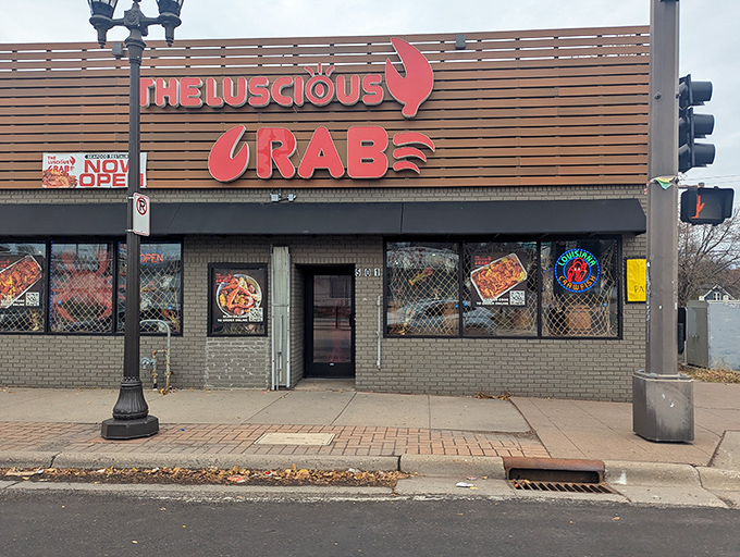 The Luscious Crab's pink signage practically glows with the promise of messy, delicious seafood feasts ahead.