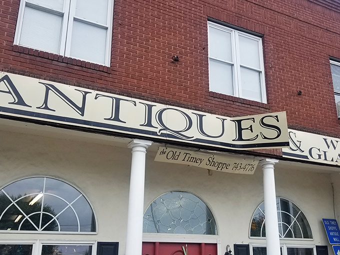 Those elegant arched windows at The Old Timey Shop frame a world where yesterday's treasures await new admirers.