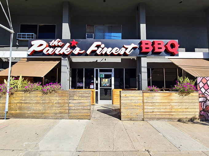 The Park's Finest sign glows with promise, a beacon of Filipino-influenced barbecue in Los Angeles.