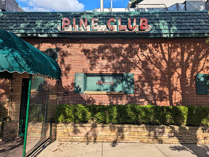 The Pine Club's brick exterior whispers promises of perfectly grilled steaks that'll make your taste buds sing.