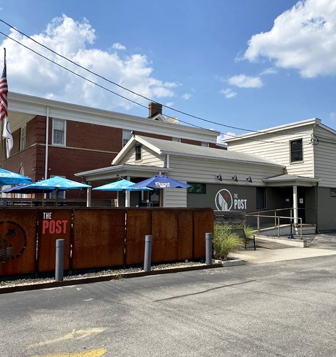 The Post's outdoor patio with its rustic metal fence practically begs you to enjoy a slice in the Kentucky sunshine.