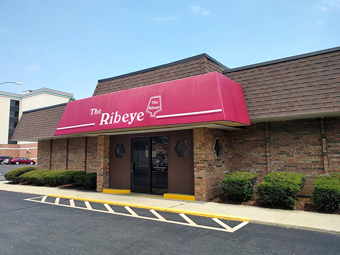 That bright pink sign practically shouts "We do ribeyes right!" from the rooftop.