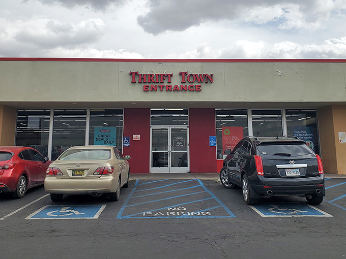 Red entrance doors beckon like a gateway to secondhand paradise where bargains multiply endlessly.
