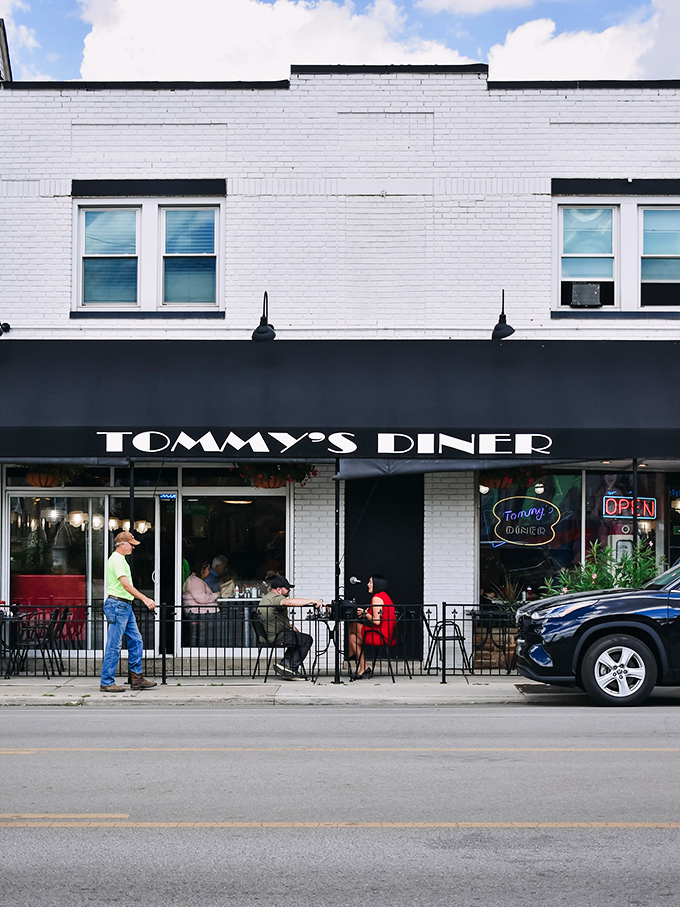Tommy's Diner's crisp white facade and sidewalk seating invite you to step back in time for a meal.