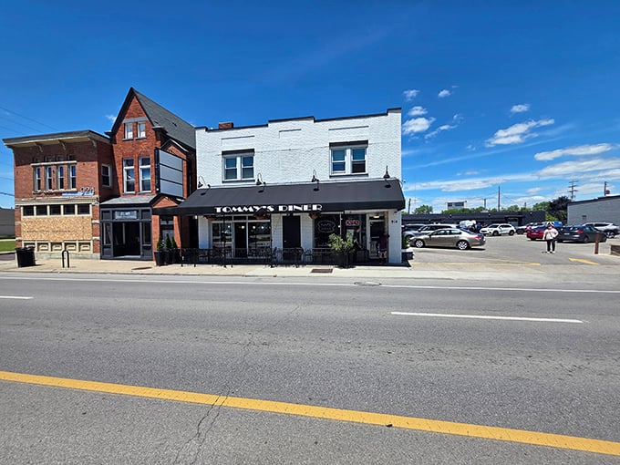 That bold awning stands out like a beacon for anyone craving classic diner vibes and timeless comfort food.