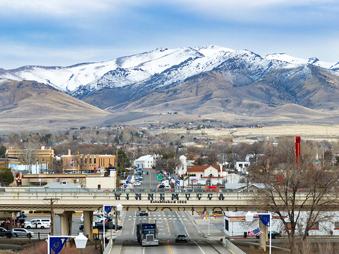Winnemucca's main drag sits beneath majestic mountains, offering budget-friendly shopping with a spectacular backdrop.