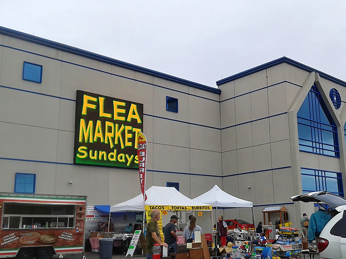 Sunday morning fever at Wolff's Flea Market. The neon sign shouts what treasure hunters already know&mdash;this is the place to be.