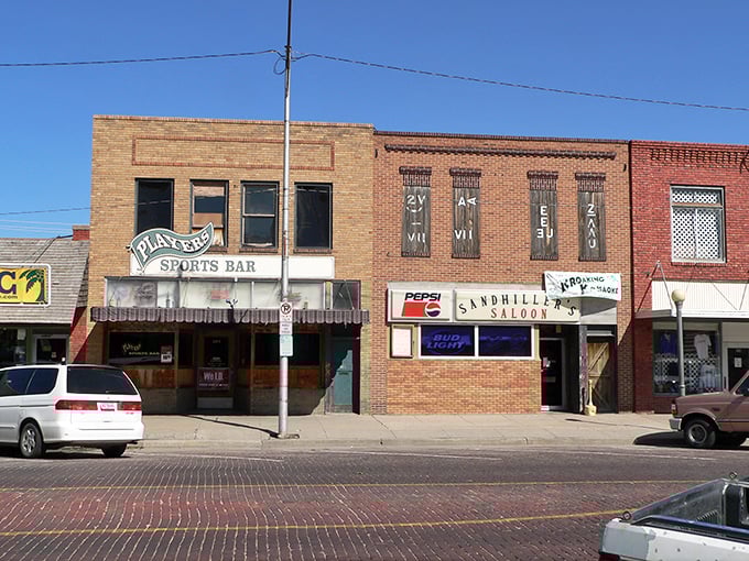 Small-town businesses line up like old friends, each storefront telling its own neighborhood story.