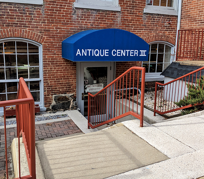 That blue awning marks the spot where history meets commerce in a building that's as much a treasure as what's inside.