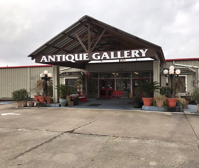 The rustic overhang and welcoming planters promise authentic treasures waiting just beyond those glass doors.