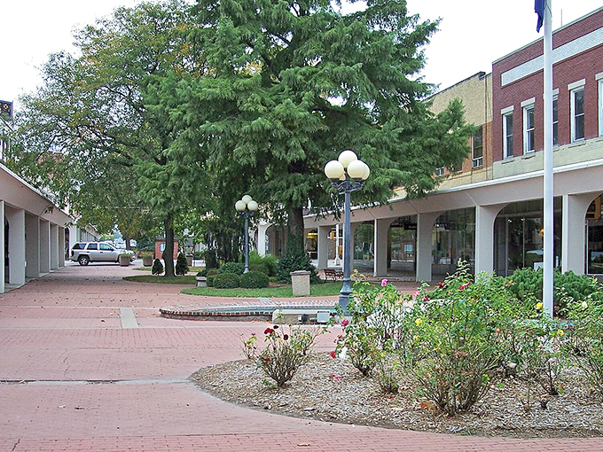 This peaceful plaza offers shaded benches perfect for watching the world go by at Kansas pace.