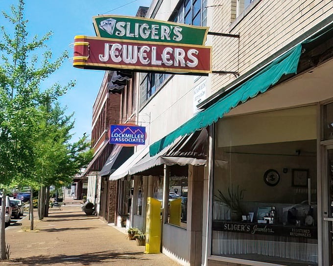 Sliger's Jewelers sign beckons shoppers on Athens' Main Street, where local businesses thrive without big-city price tags.