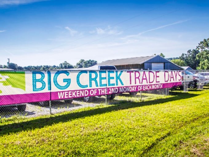 The cheerful banner announces trade days like a circus coming to town every month.