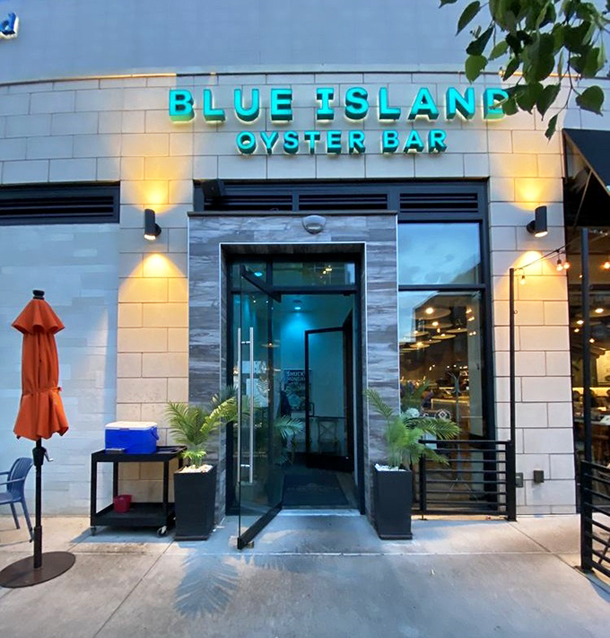 The glowing blue sign of Blue Island Oyster Bar beckons like a lighthouse for landlocked seafood lovers.