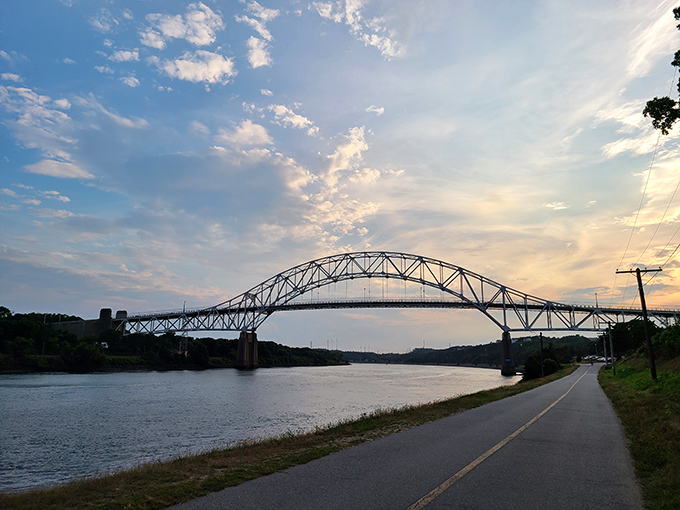 Bourne's iconic bridge arches gracefully over the canal, where sunset strolls become daily rituals for lucky locals.