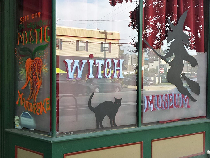 The Witch Museum's colorful window display promises mystical adventures inside. Black cats and broomsticks included!