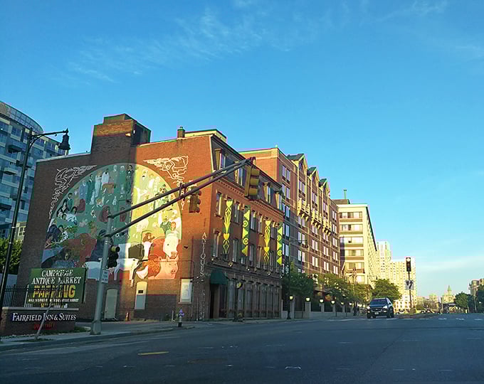 Urban antiquing at its finest! This historic building stands tall among modern Cambridge, like your eccentric great-uncle at a tech conference.