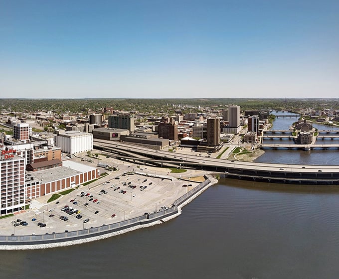 The Cedar River flows through Cedar Rapids, carrying away your financial worries along with its gentle current.