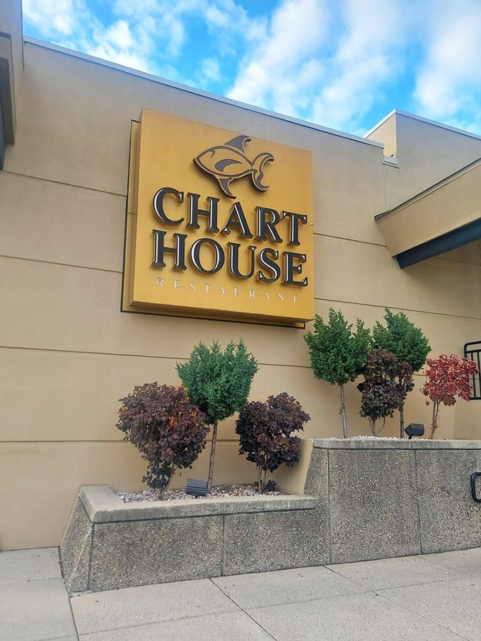 The golden Chart House sign promises an elegant seafood experience where the Ohio River provides the perfect backdrop.