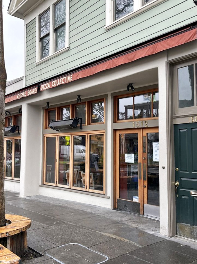 Berkeley's collective approach to pizza perfection. That red awning signals you've arrived at sourdough heaven.