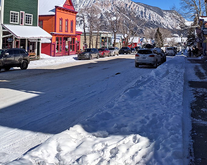 Winter transforms Crested Butte&rsquo;s colorful downtown into a snow-dusted postcard framed by rugged mountain peaks.