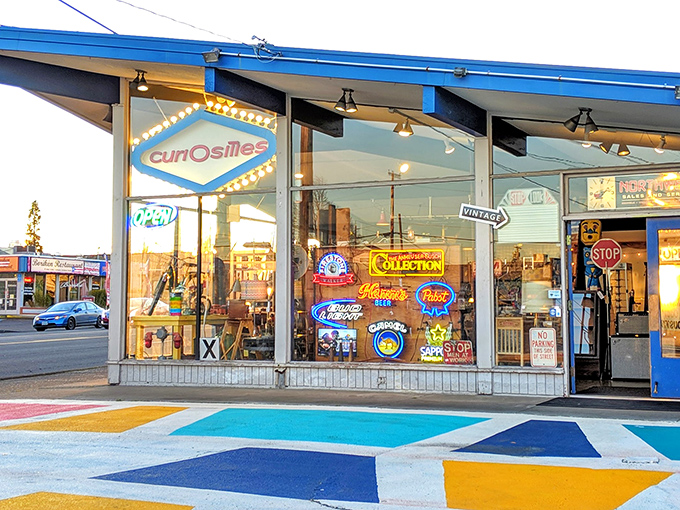 Window displays bursting with vintage signs and colorful treasures &ndash; like peeking into a time capsule curated by a design genius.