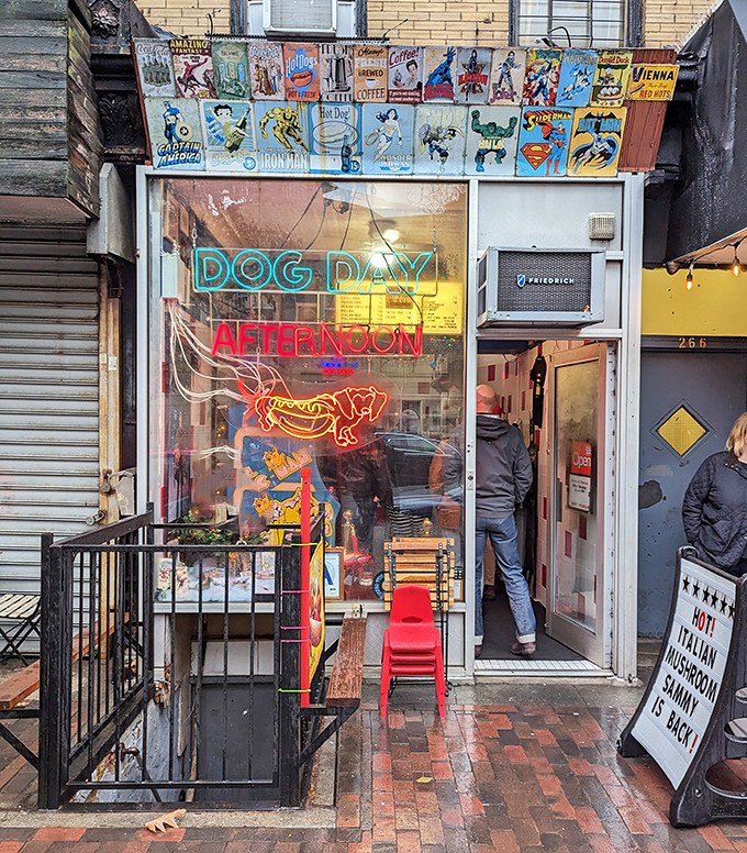 That neon hot dog glowing in the window is basically the Bat-Signal for hungry folks.