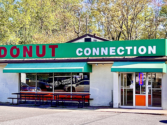 Donut Connection's bright green awning and picnic tables create the perfect spot for an impromptu donut picnic on a sunny Maryland morning.