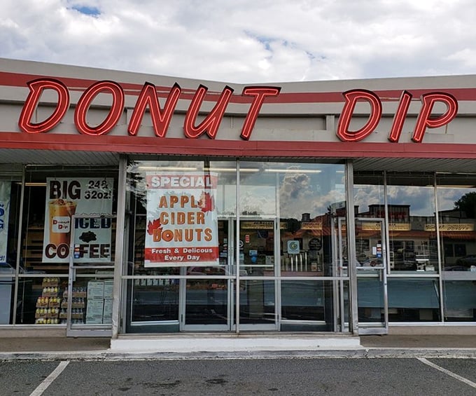 The bright orange Doughboy sign wraps around the corner, impossible to miss &ndash; like a neon lighthouse guiding you to donut paradise.