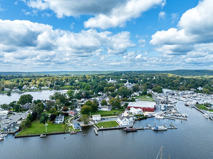 The picturesque waterfront of Essex shows why this seaside town feels straight from a movie, with boats dotting the harbor and historic homes lining the shore.
